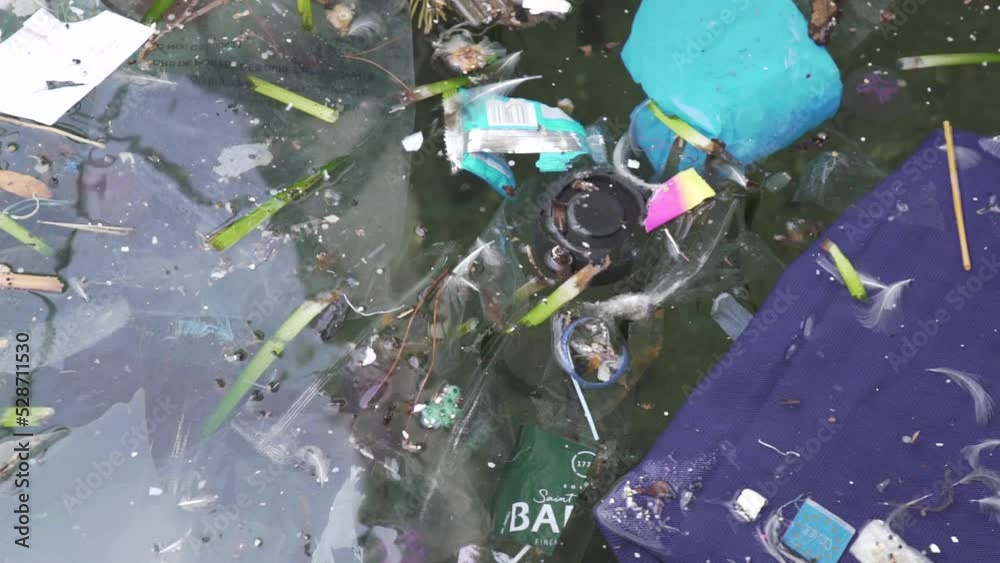 Water pollution with plastic bag and floating trash Stock Video | Adobe ...