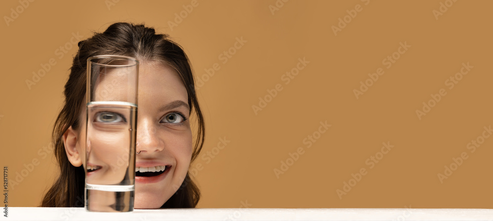 Creative art photography. Stylish girl's face through wine glass over ...