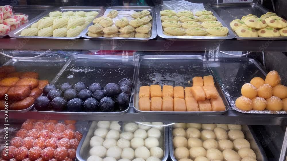 Variety of delicious Indian Bengali Sweets - gulab jamun, rasogulla ...