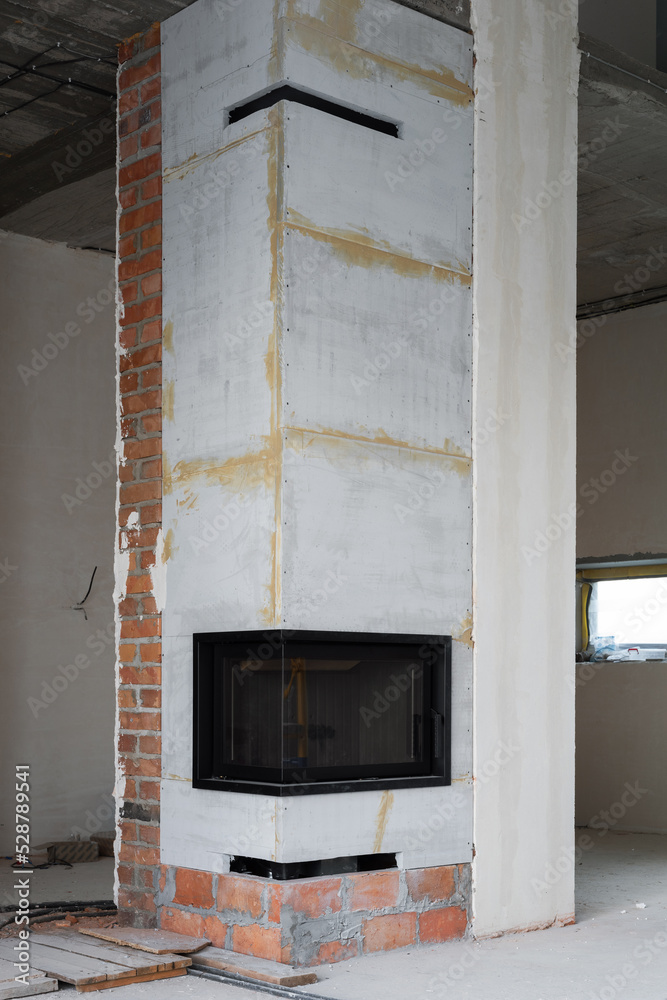 Fireplace installation. Installing of manufactured enclosed corner ...