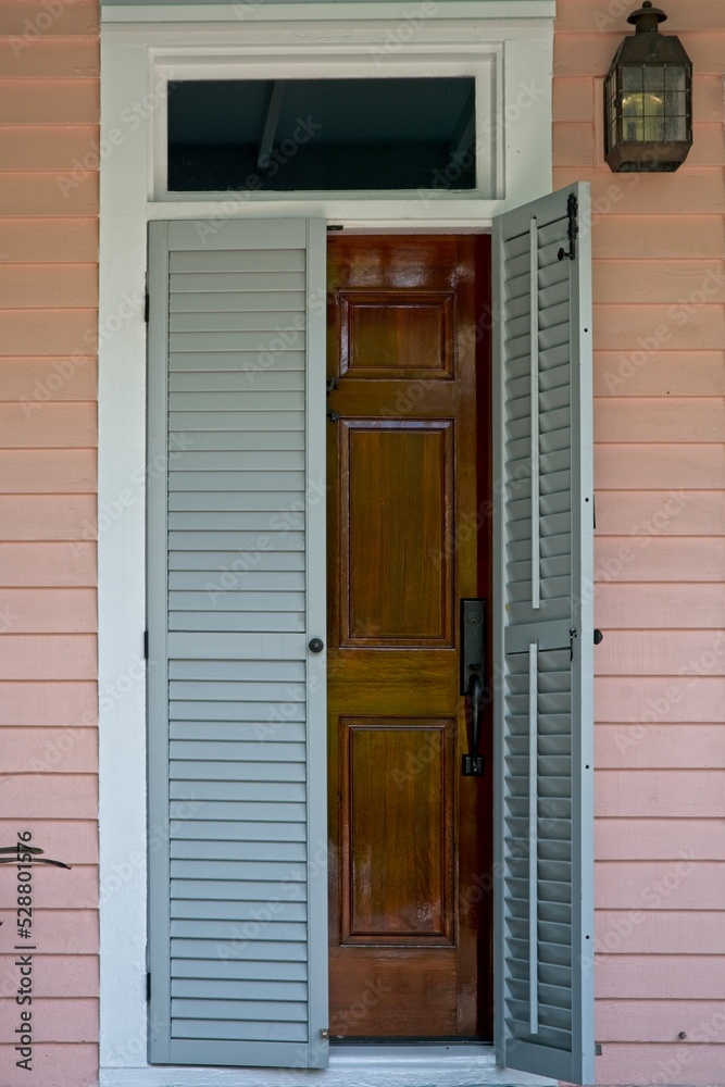 Key West wooden doorway with transom and shutters Stock Photo | Adobe Stock
