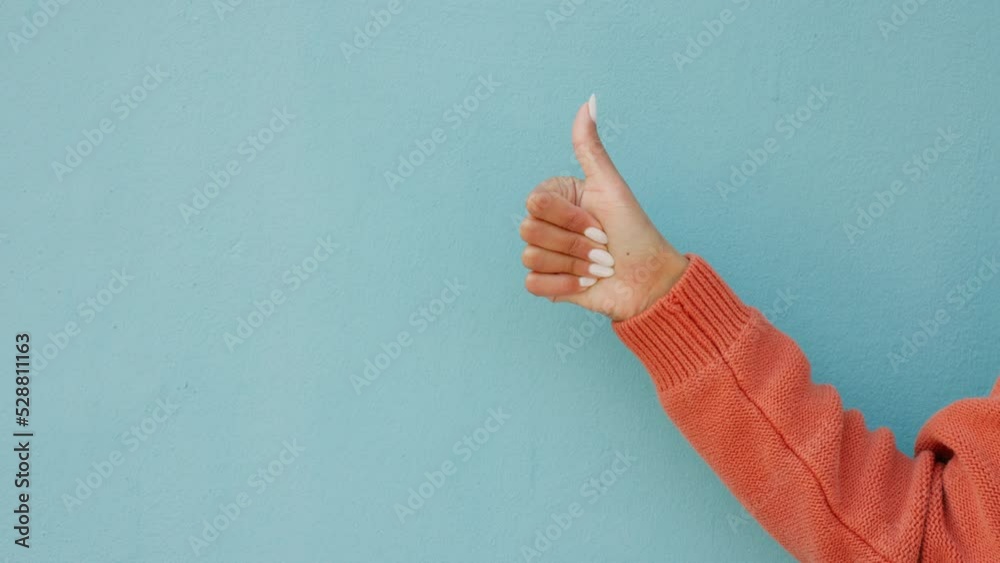 Thumbs up, like and hand emoji mockup on studio or blue wall background ...