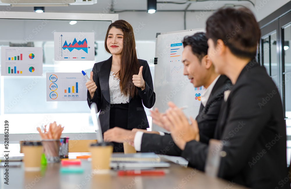 Asian young beautiful professional successful businesswoman presenter ...