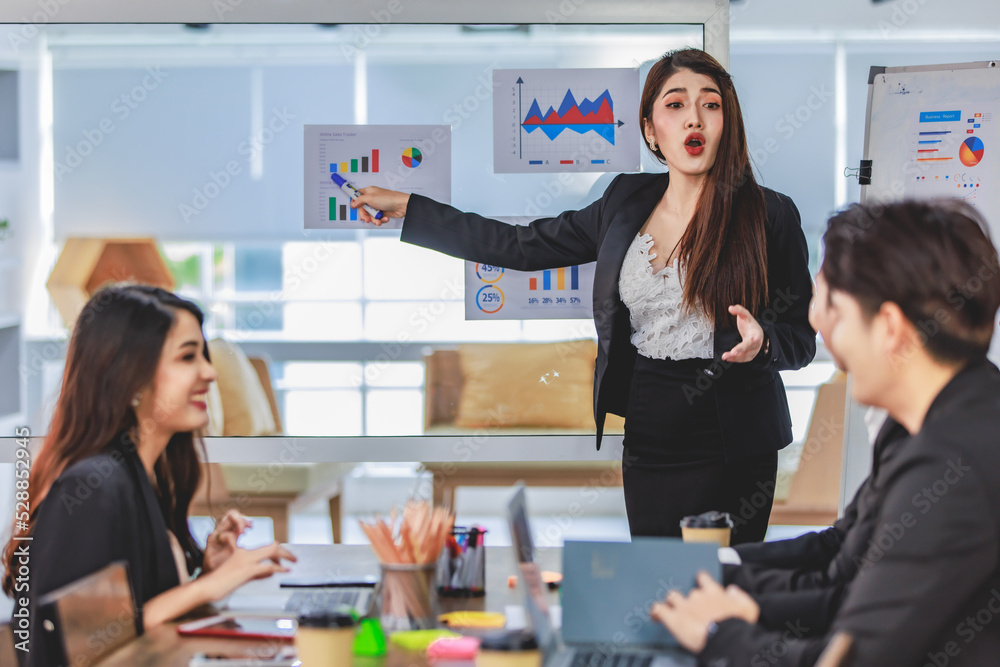 Asian young beautiful professional successful businesswoman presenter ...