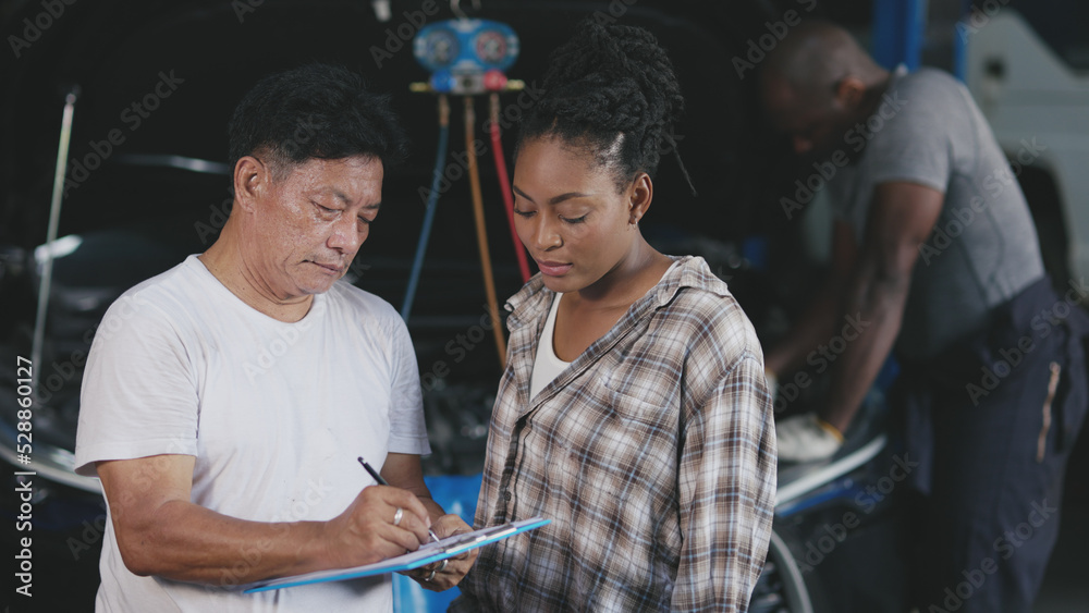 garage businessman talking explain to car owner about check list ...