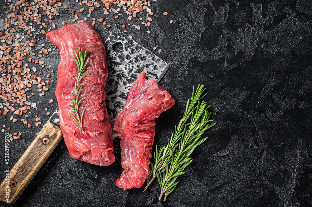 Whole Beef tenderloin meat, raw tender loin on butcher table. Black ...
