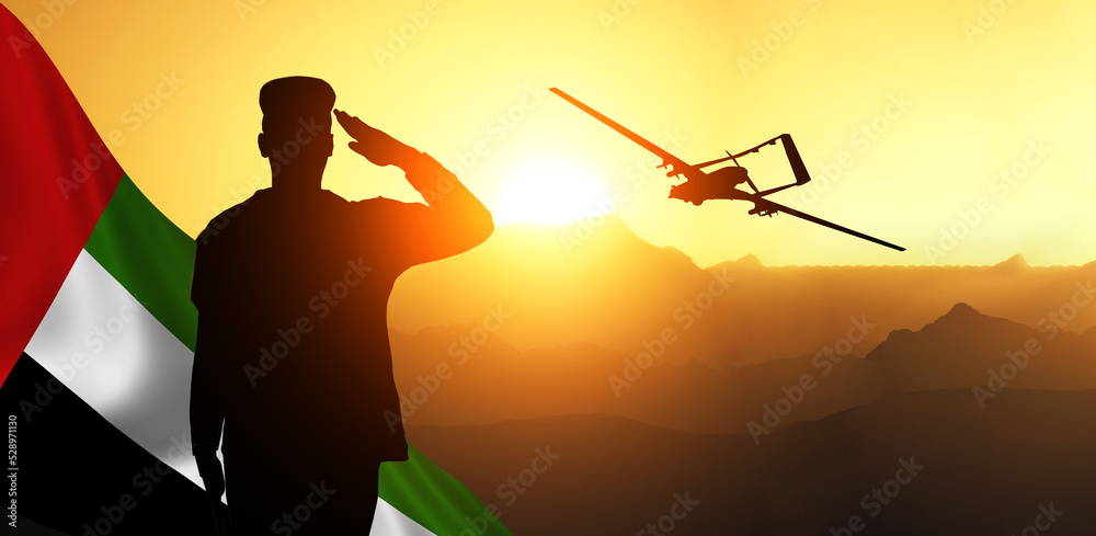 Silhouette Of A Solider Saluting Against the flag of UAE. Concept of ...