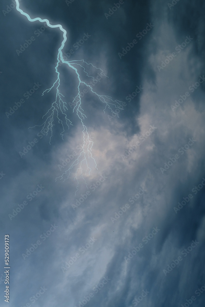 dramatic stormy sky with dark clouds, lightning flashes over the night ...