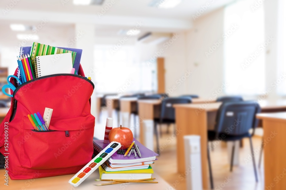School classroom. New school bag on a student's desk in the classroom ...
