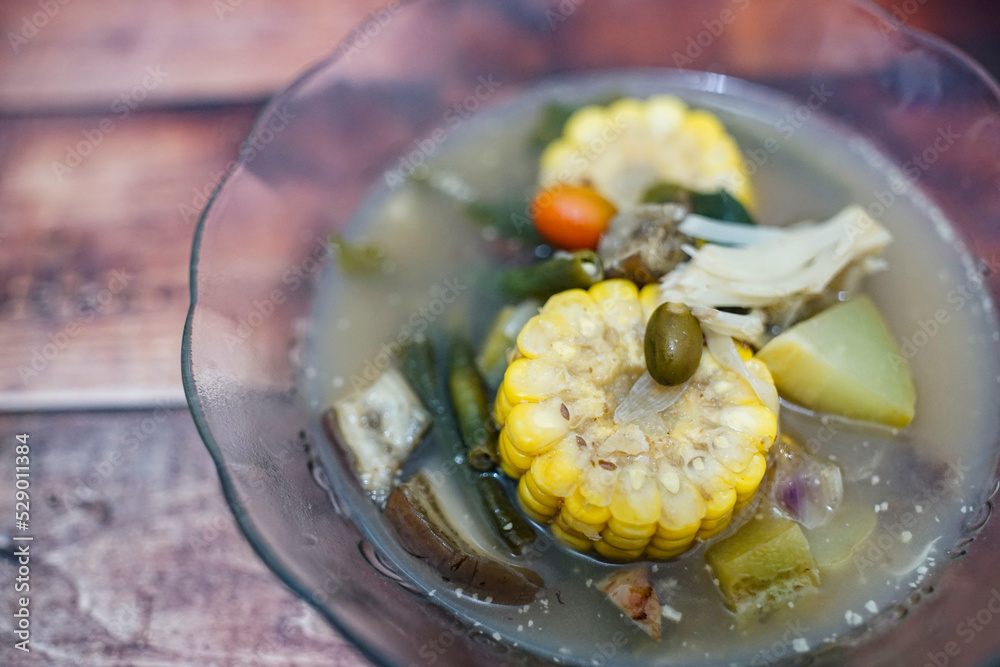 Sayur Asem. consisting of corn, beans, etc. Indonesian traditional food ...