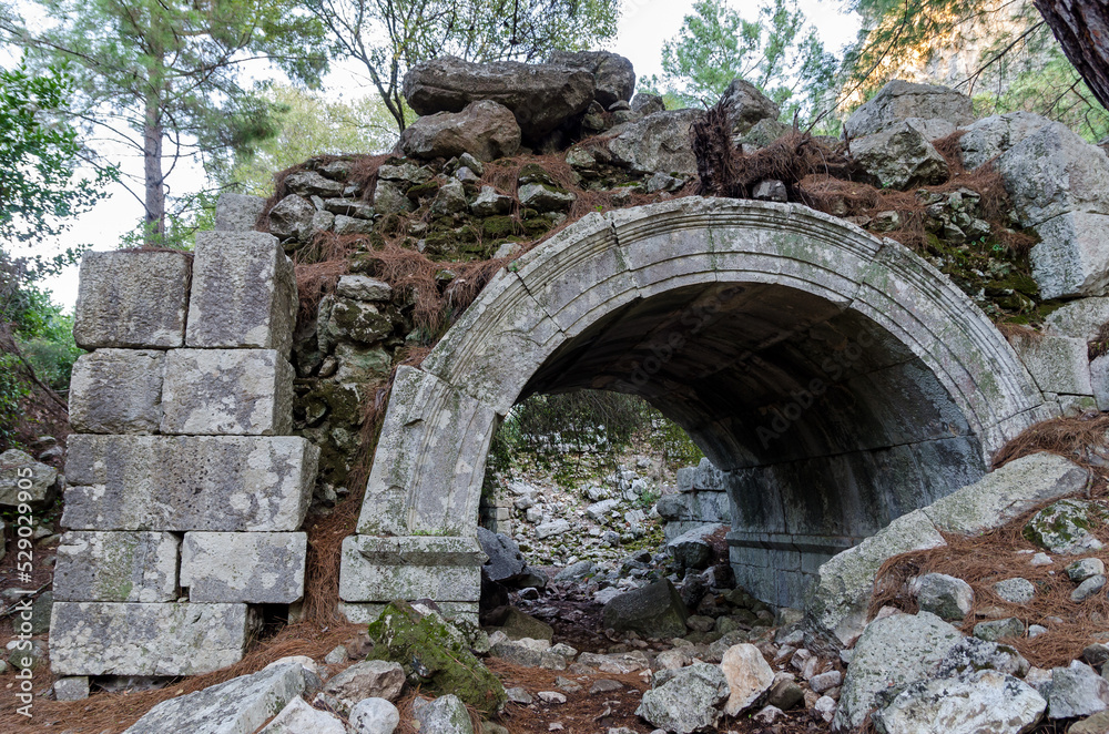 The ruins of the arched entrance to the amphitheater of the ancient ...