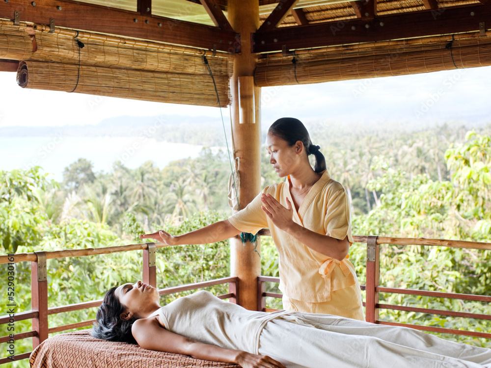 Therapist doing reiki at a spa. Koh Samui, Thailand. Stock Photo ...