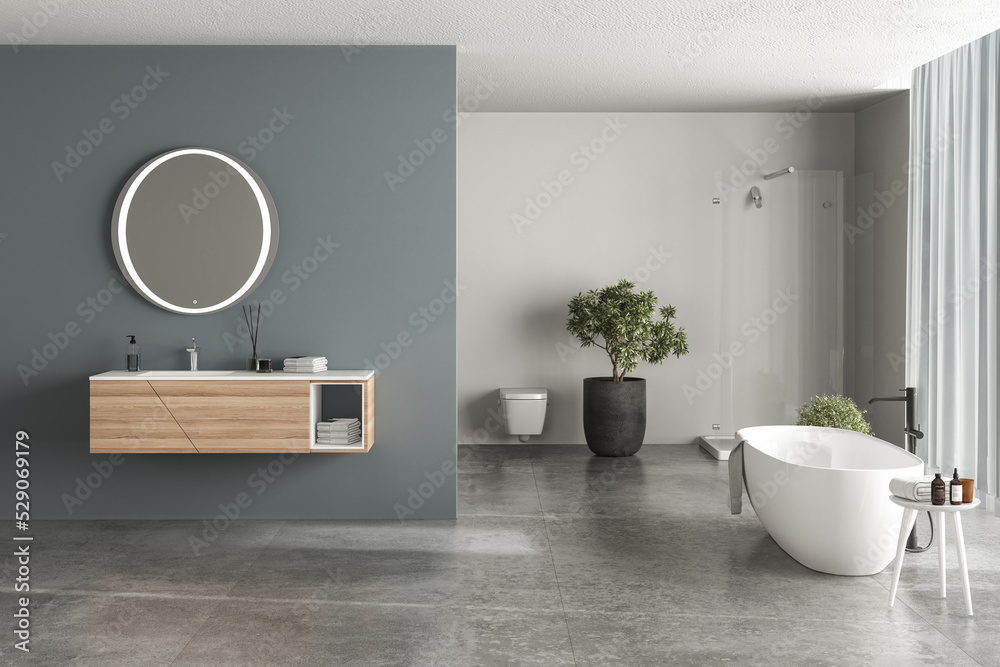 Modern bathroom interior with blue background, concrete flooring, white ...