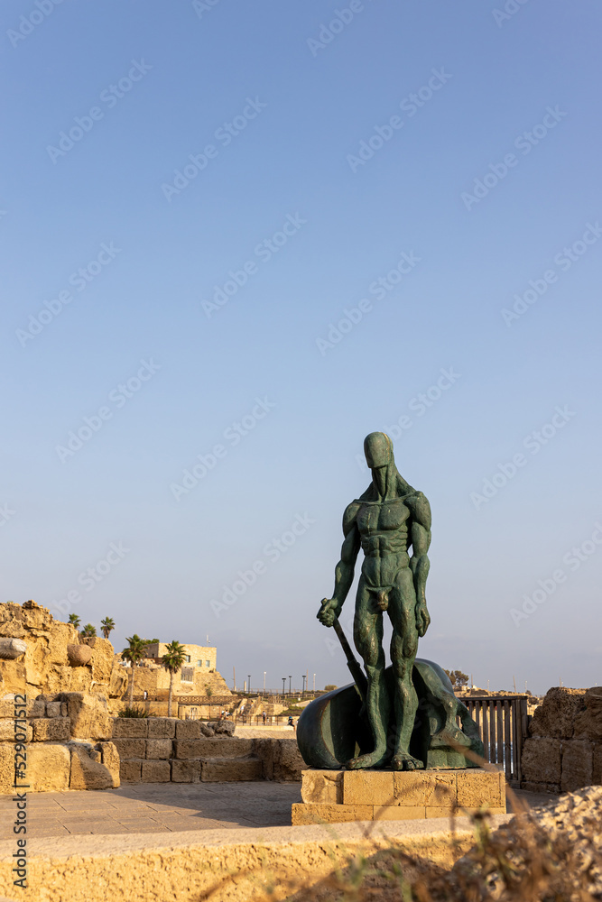 CAESAREA, ISRAEL - SEPTEMBER 01, 2022: Statue of a naked man in ancient ...