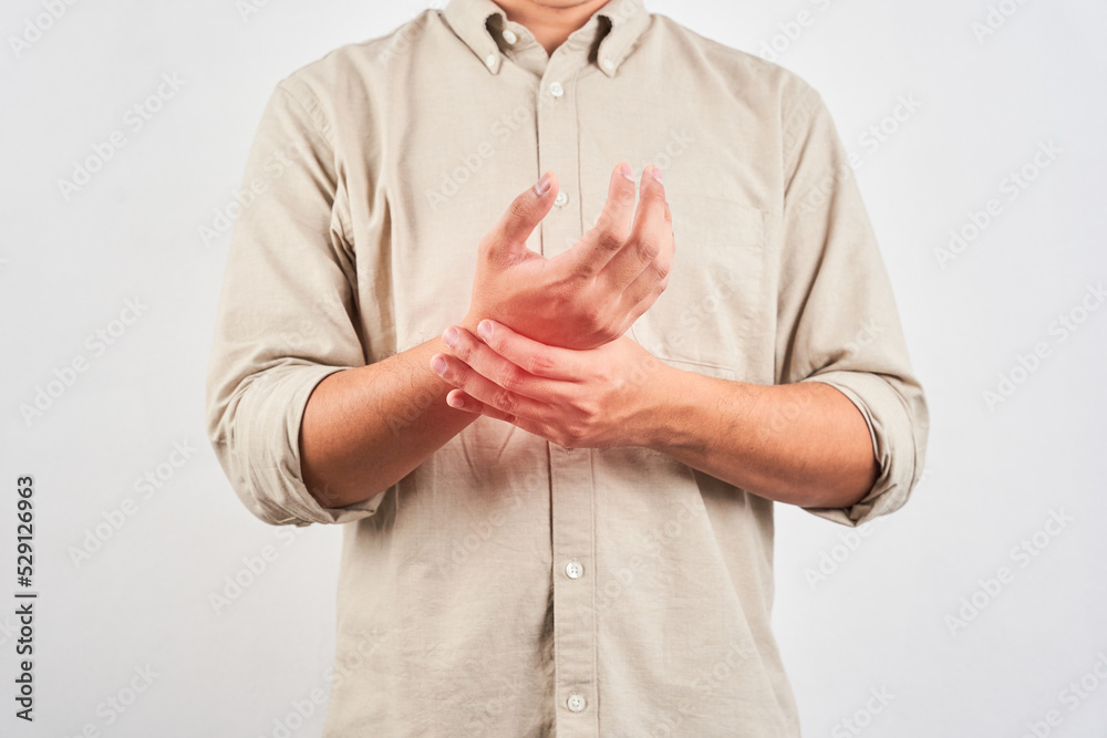 Asian male arms holding his painful wrist. Asian man hand holding his ...