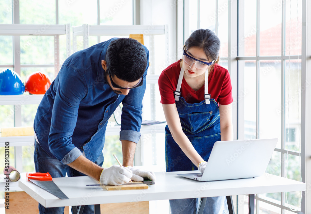 Indian professional male engineer foreman labor worker using laptop ...