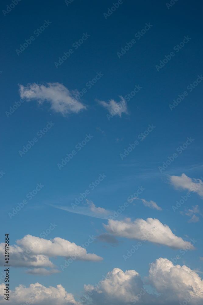 Cover page with soft blue sky with illuminated clouds as a background ...