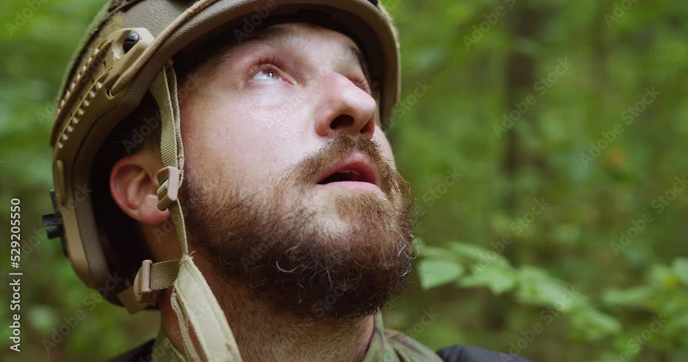 the sniper aims at the optical sight then raises his face to the sky ...