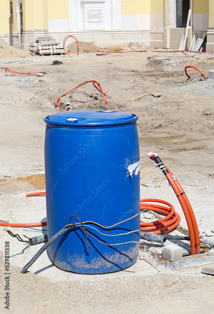 Large plastic barrel at the construction site Stock Photo | Adobe Stock