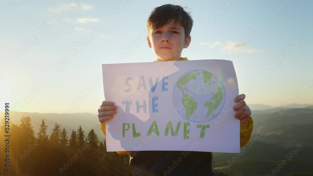Green planet earth. Save the planet poster protest boy holding in front ...