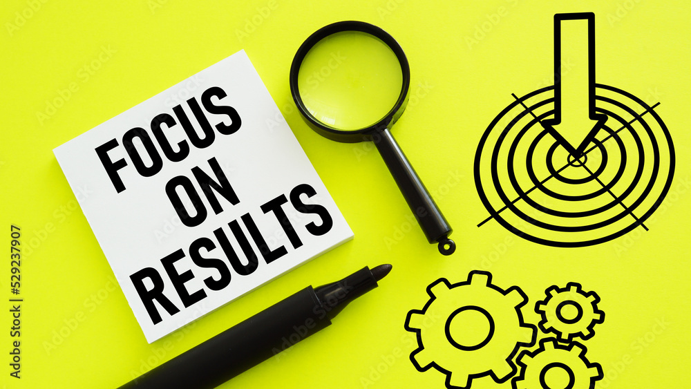 Focus on results is shown using the text and picture of aim and photo ...