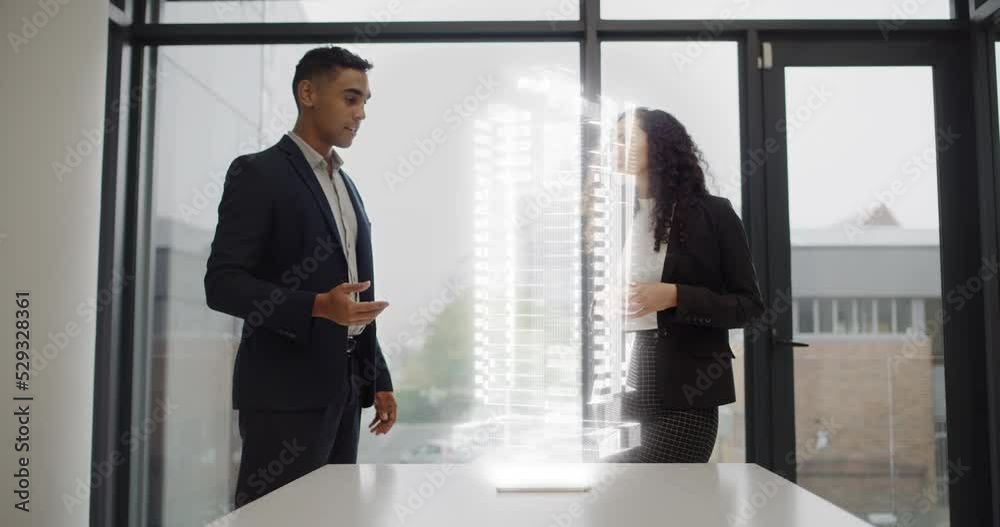 Architect working on a futuristic hologram building for company ...