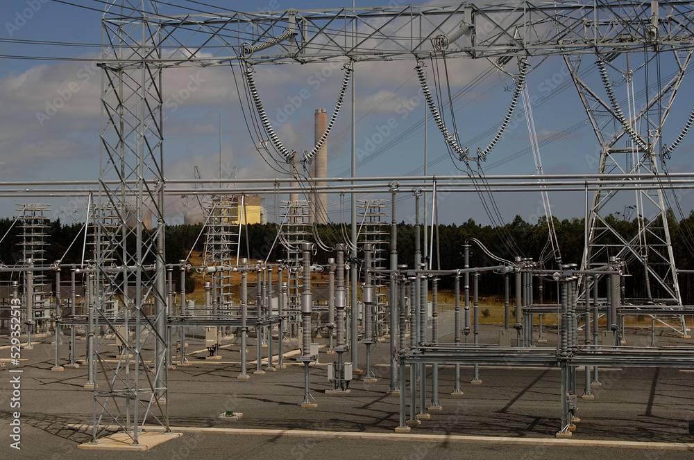 Electricity generating power plant showing high voltage insulators and ...