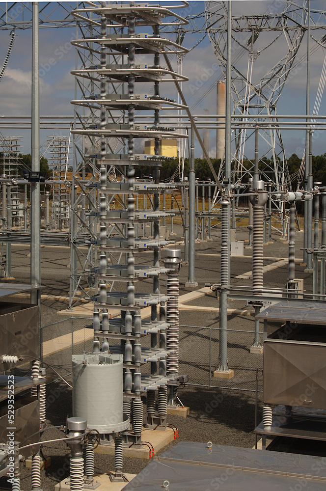 Electricity generating power plant showing high voltage insulators and ...