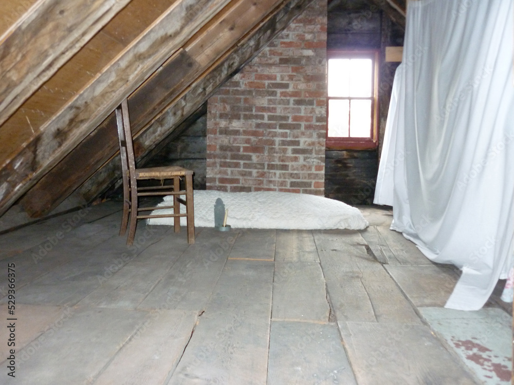 Interior of an attic roof space with a timber floor and wooden roof ...