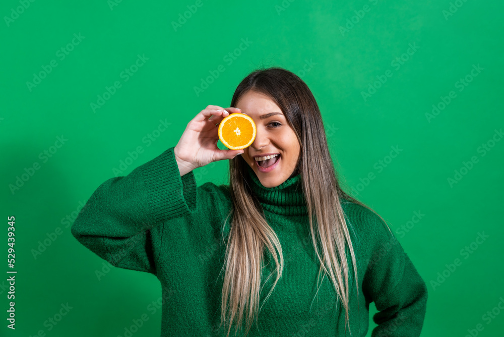 Young beautiful woman or girl model posing in front of green screen ...