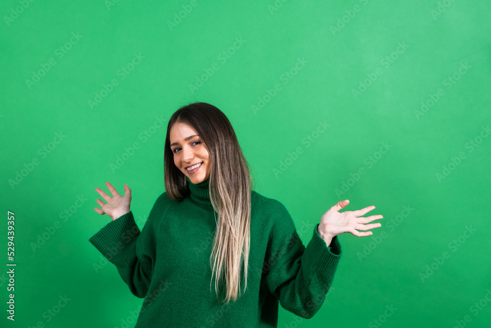 Young beautiful woman or girl model posing in front of green screen ...