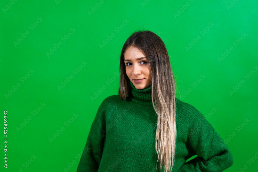 Young beautiful woman or girl model posing in front of green screen ...