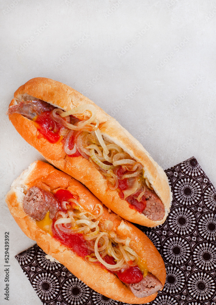 South African famous boerewors roll, juicy and topped with onions on a ...