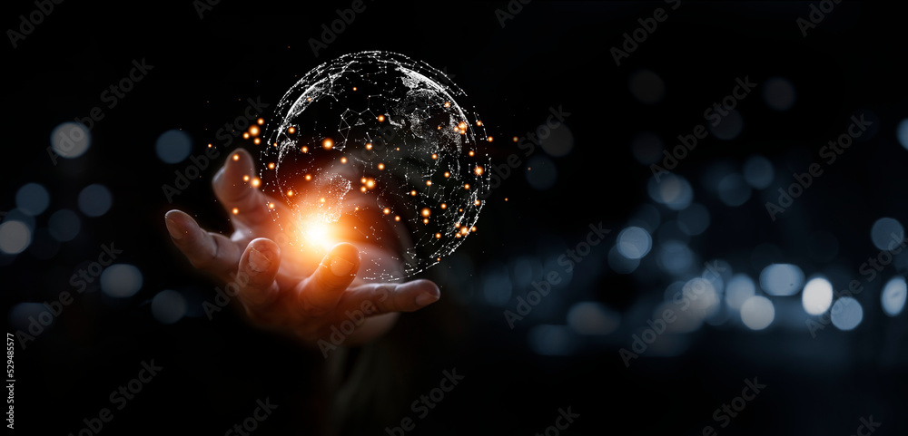 Hand of a man holding virtual world with bokeh backgrounds, technology ...
