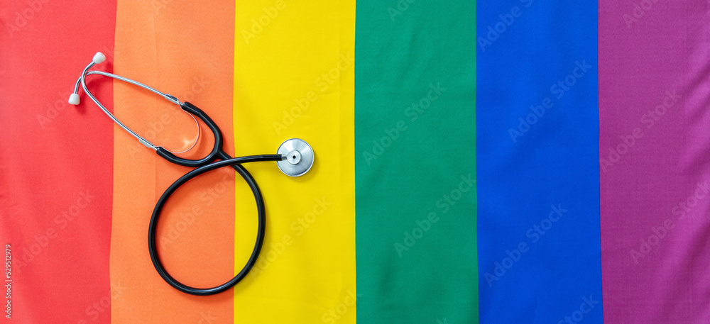 LGBT Health care. Medical Stethoscope on rainbow pride flag background ...