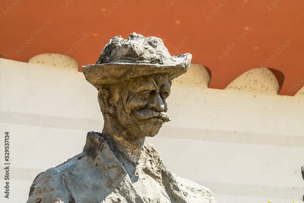 BUCHAREST, ROMANIA -June 2022: The statue of romanian writter Ioan Luca ...