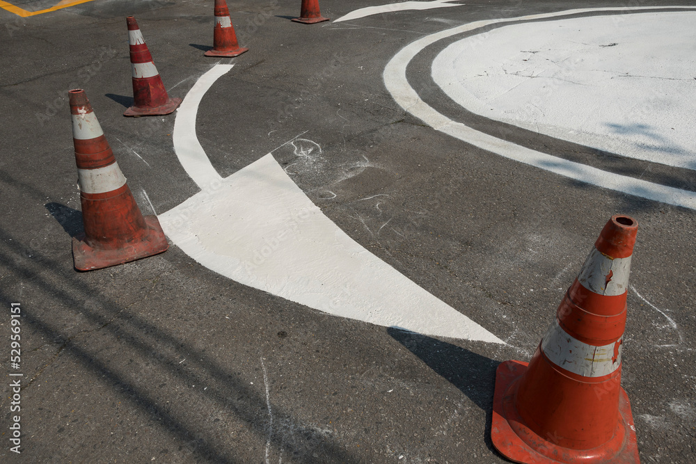 Traffic signage. Asphalt painting. Direction arrow at intersection ...