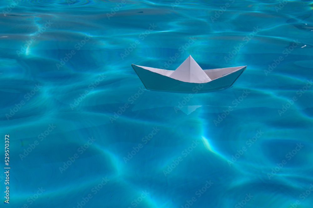 Cruise liner paper art. Paper boat sailing away on sea surface water ...