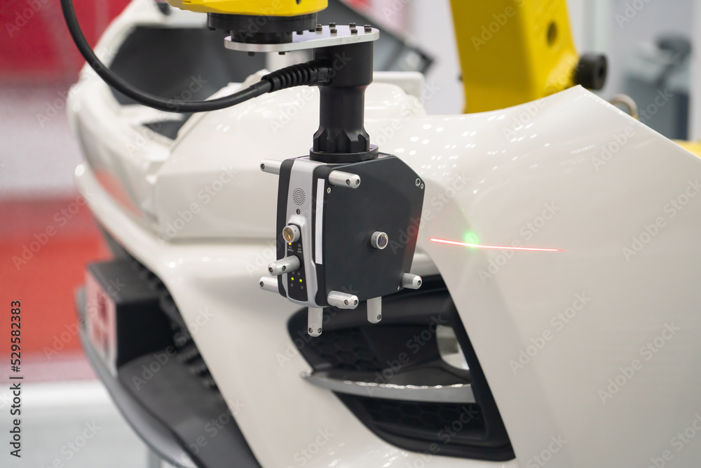 T-SCAN 3D scanner with Robotic arm in automotive industry. Industrial ...