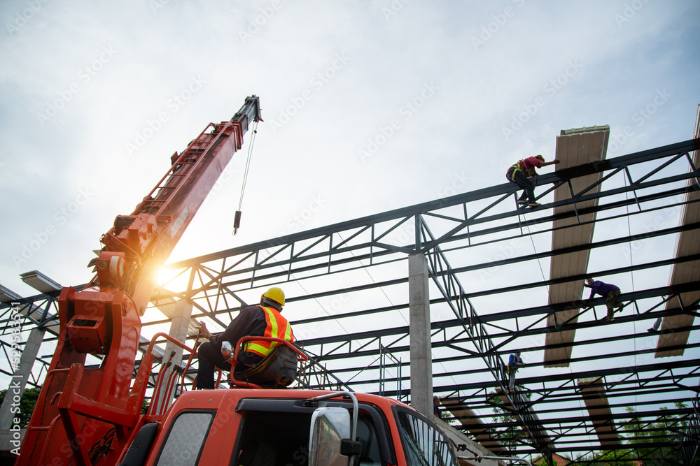 Asian crane drivers force cranes to deliver metal sheet to install ...
