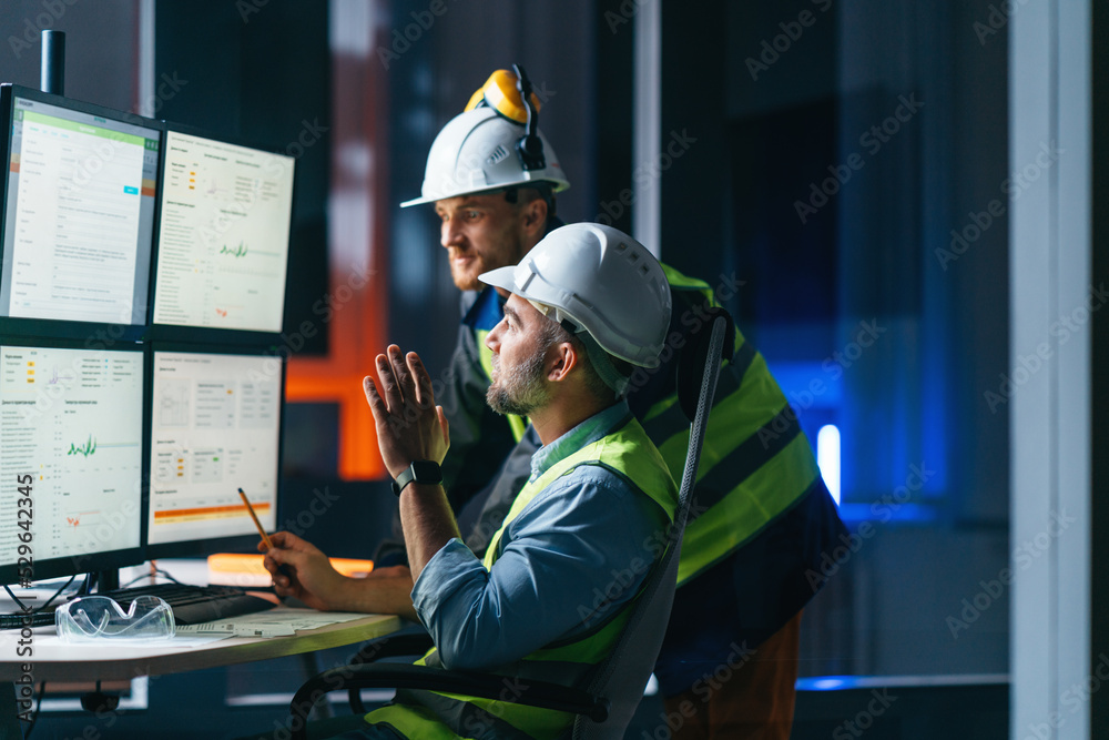 Group of operators control process on product line uses industry 4.0 ...