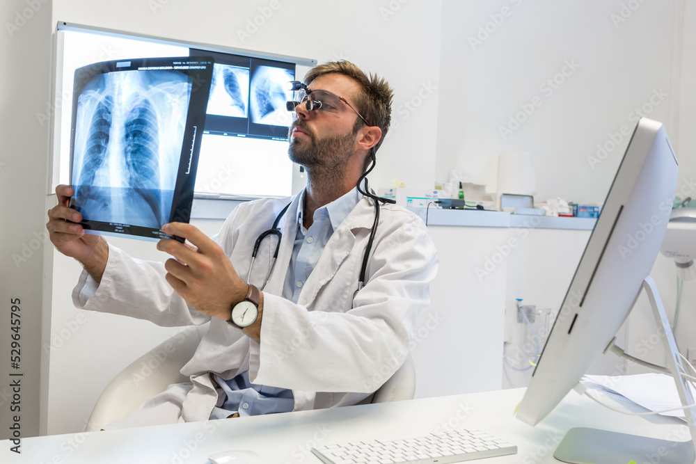 pulmonologist Doctor looks at a chest x-ray - clinic medical concept ...