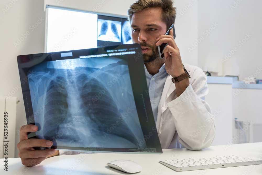pulmonologist Doctor looks at a chest x-ray - clinic medical concept ...