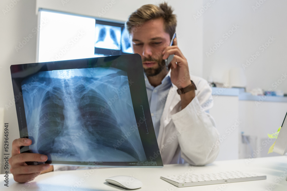 pulmonologist Doctor looks at a chest x-ray - clinic medical concept ...