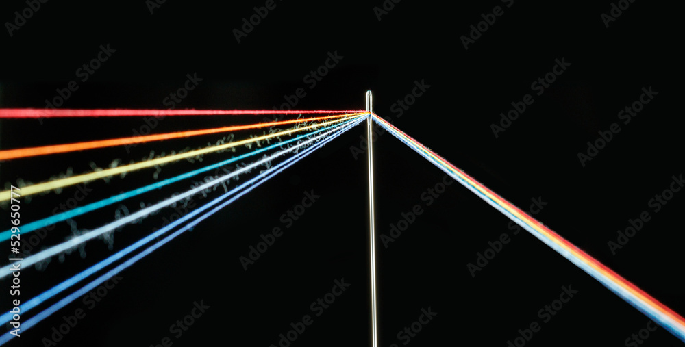 multi-colored threads for sewing in the form of a rainbow pass through ...