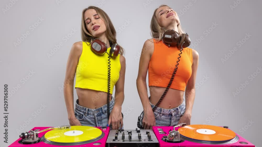 Twin female DJs with turntables Stock Video | Adobe Stock