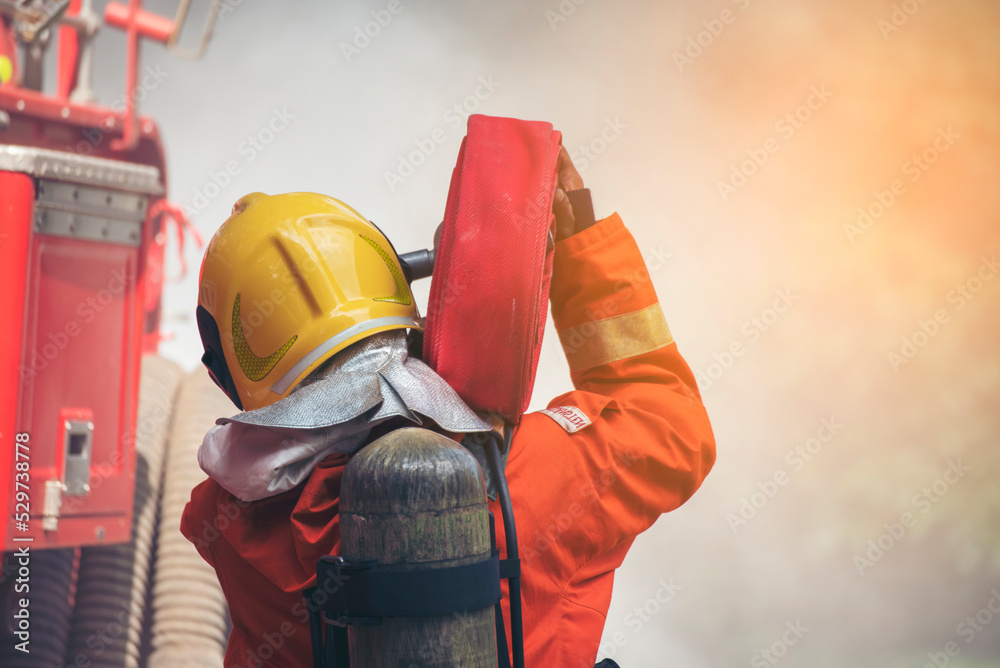 Firefighter Rescue training in fire fighting extinguisher. Firefighter ...