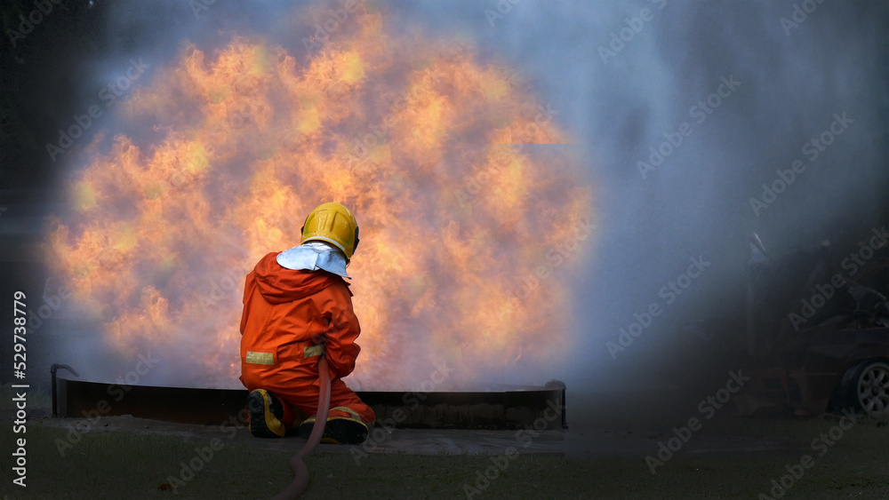 Firefighter Rescue training in fire fighting extinguisher. Firefighter ...