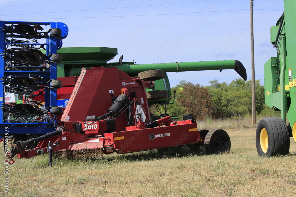 Bush Hog with Combine and disc at a Dealership with sky. Stock Photo ...
