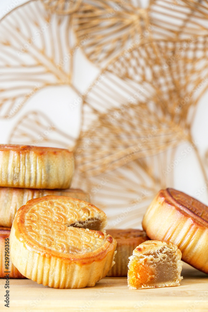 Vertical shot of traditional Chinese Mid-Autumn Festival mooncakes laid ...